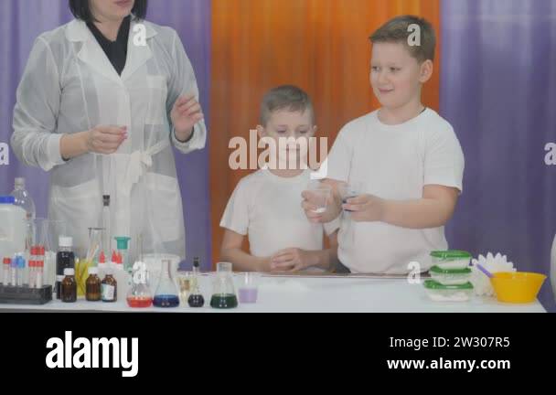Chemical experiments for children. Fun experiments for children. Woman ...