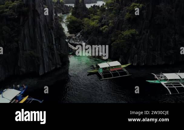 Aerial view of turquoise tropical lagoon with Karst limestone cliffs in ...