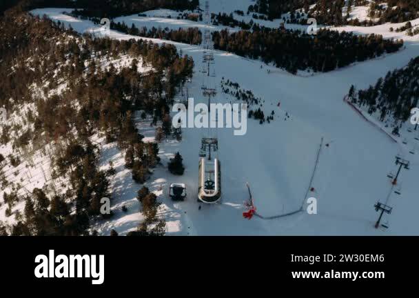 Top view from drone ski lift for transportation skiers and snowboarders ...