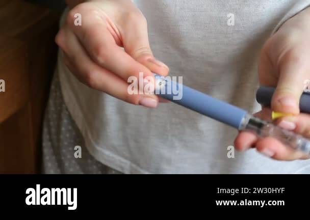 Close-up of a woman makes an injection of insulin in the stomach ...