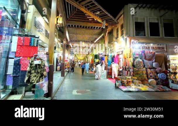 DUBAI, UAE - MARCH 1, 2020: Evening walk in Dubai Old Souk market with ...