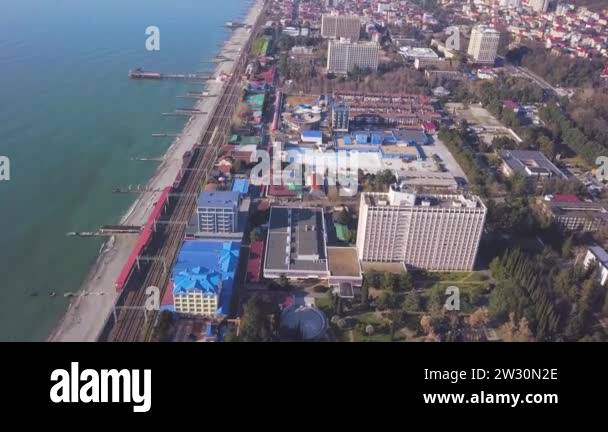 High-rise buildings located on coast on background of sea. Clip. Top ...