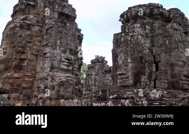 4K, Face towers depicting Bodhisattva Avalokiteshvara. Smiling faces ...