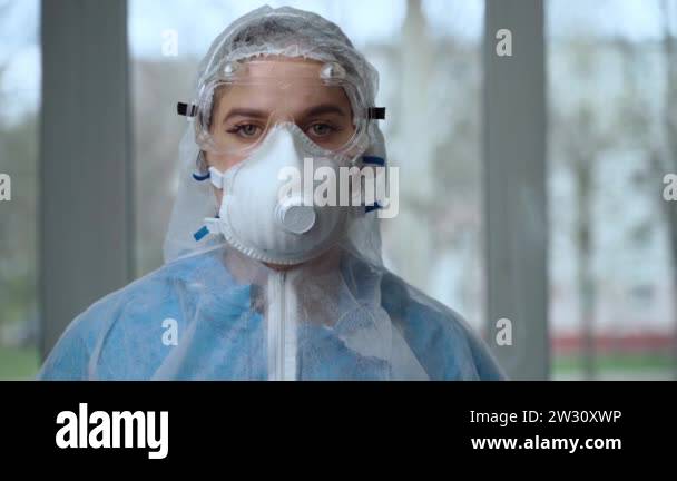 Portrait of woman doctor weaing protective suit during coronavirus ...