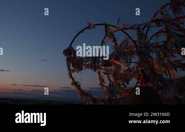 Tourists tie ribbons on wish tree, believe in miracle, symbolic ritual ...