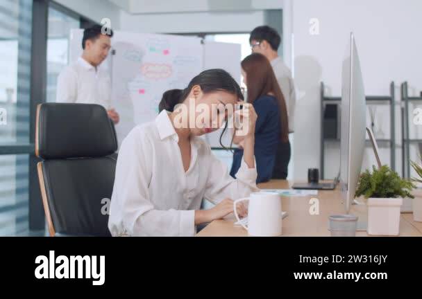 Millennial young Chinese businesswoman working stress out with project ...