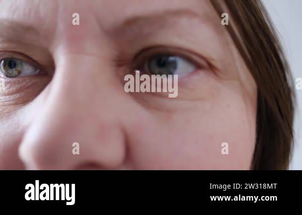 gray eye with spots on iris, wrinkles on eyelids close up, human vision ...