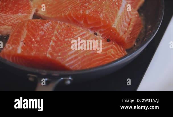 Pieces of delicious fish cooked in the kitchen. Fillet of red fish is ...