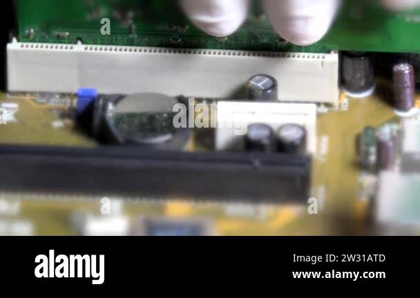 male hand in glove fix computer inside. components of computer ...