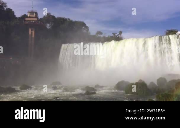 Slow motion view of one of the Cataratas waterfalls and its observation ...