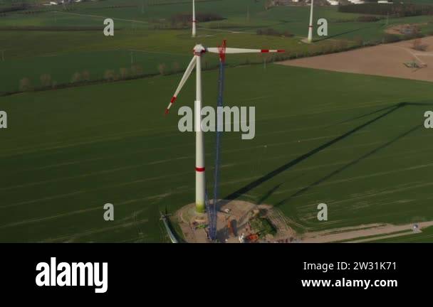 AERIAL: Wide View of Wind Turbine under construction being build on ...