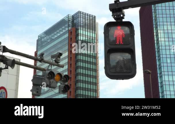 4K Asian pedestrian crosswalk sign Tokyo city traffic change from red ...