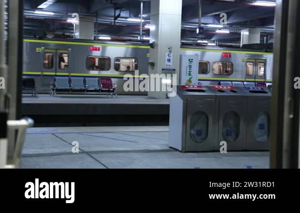 two trains cross in a train station Taiwan, traveler see from inside a ...