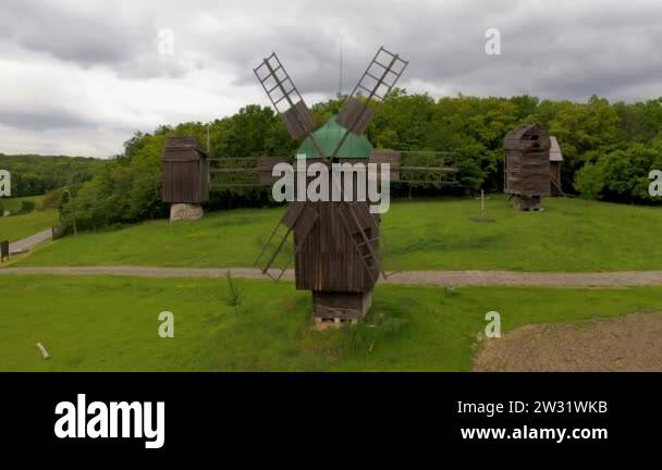 Traditional ukrainian wooden windmill in Pirogovo. Panorama from left ...