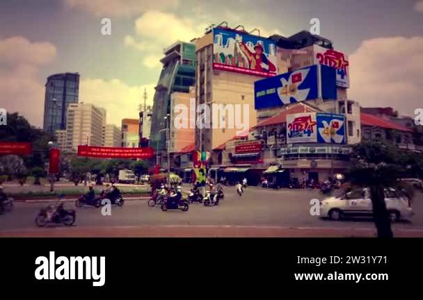 Ho Chi Minh City - Retro look roundabout traffic view with 40th ...