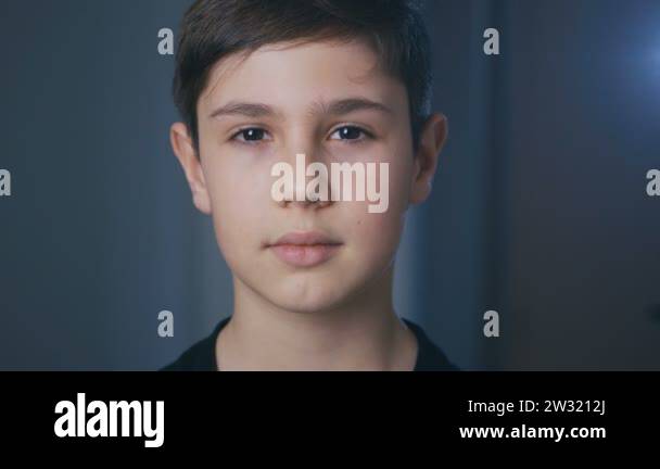 Portrait of cute boy of 11 ages looking at camera at home in the ...