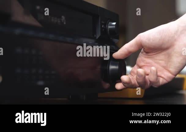 Young man in sound recording studio. Cut view video of mans hand ...