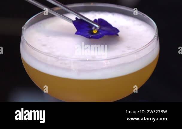 The process of making a cocktail. The barman's making a cocktail at the ...