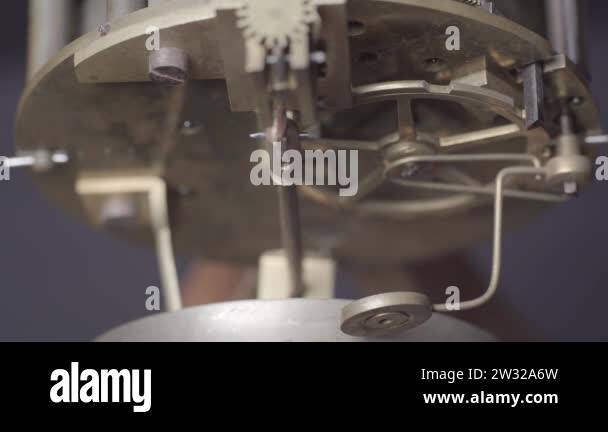 An inside view macro shot of an antique vintage clock with a detailed ...