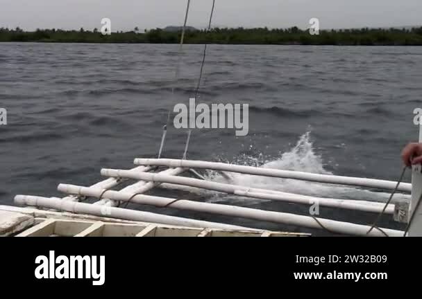 Bamboo wings of philippine boat in sea on islands of Republic of ...