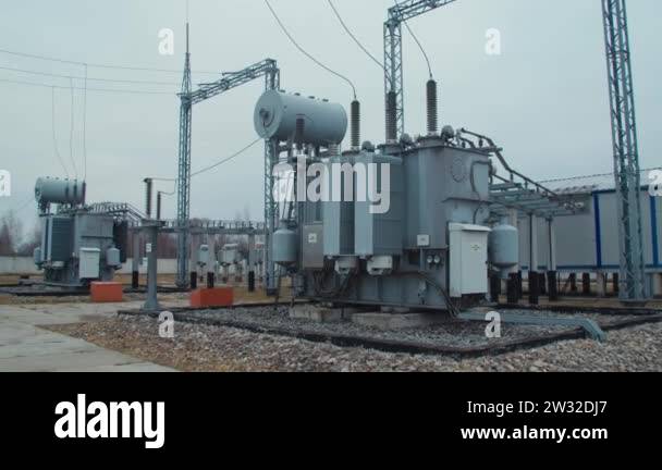 High voltage substation 110 kV with tall pylons and hog voltage ...