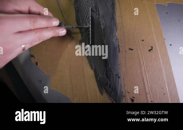 worker is making model from black plasticine for using in vacuum ...