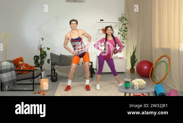 Funny retro sportsman athletes wear sports suit from 80s train at home ...