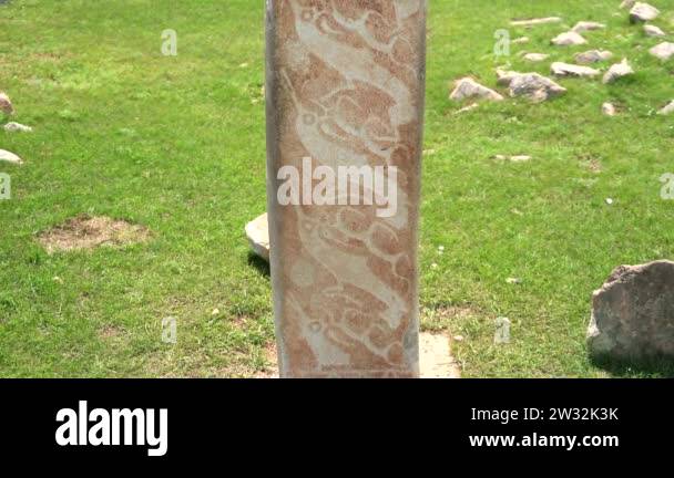 Inscription of obelisk menhir from old ancient times.Deer stone ...