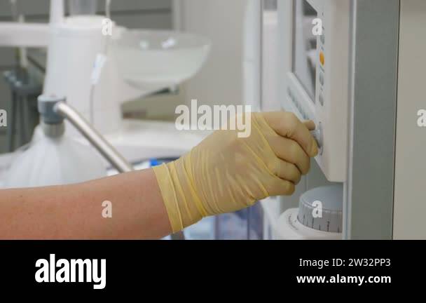 Medical worker adjusting and tuning artificial lung ventilation ...