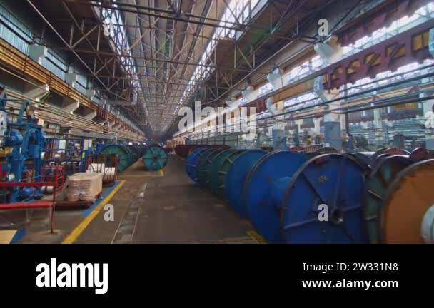 Cable factory. Metal, optical, copper, power wires are wound on huge ...