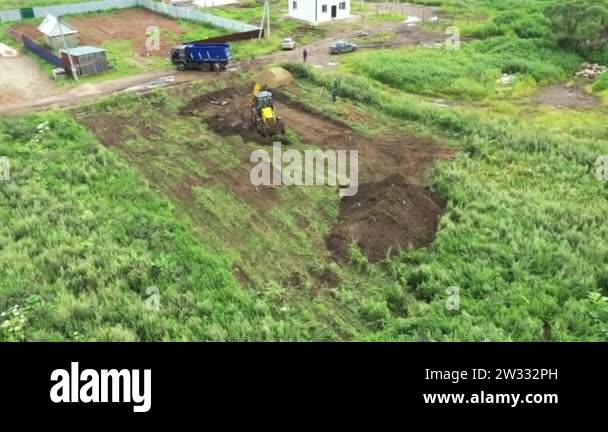 Tractor digging a hole Stock Videos & Footage - HD and 4K Video Clips ...