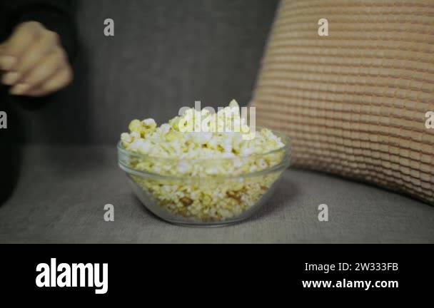 Female hand picking popcorn from paper bucket closeup. Close up of ...
