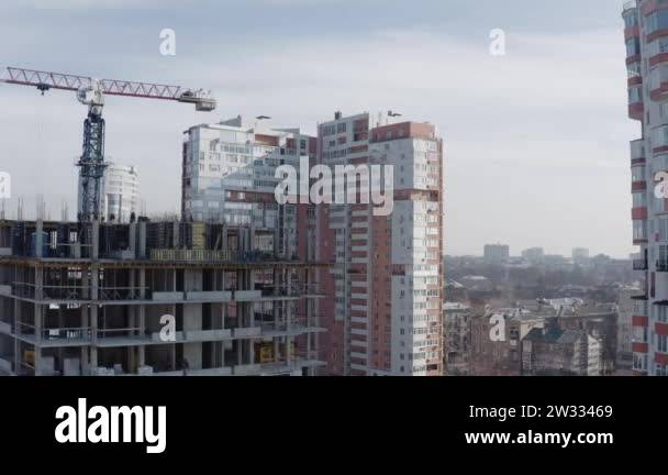 Panorama of the construction of a new high-rise building for people to ...