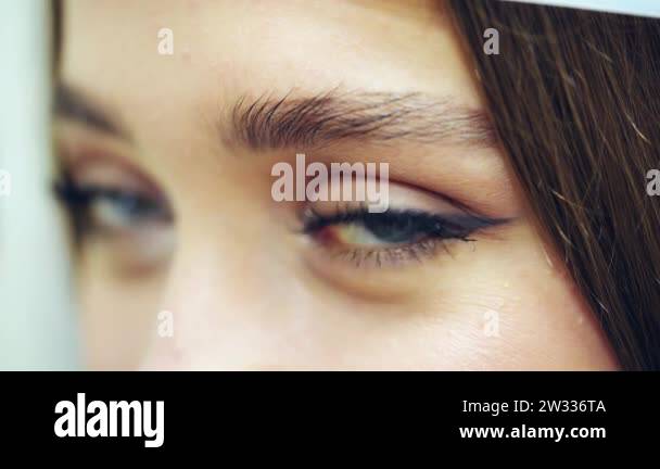Eyes examination. Close-up woman's eyes checking by a doctor. Laser ...