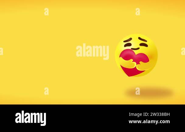 Care emoticon - yellow face with big open bright eyes hugging a red ...