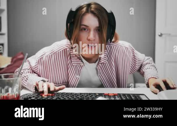 Excited Pro Gamer Girl Playing in Video Game. Woman looks at the camera ...