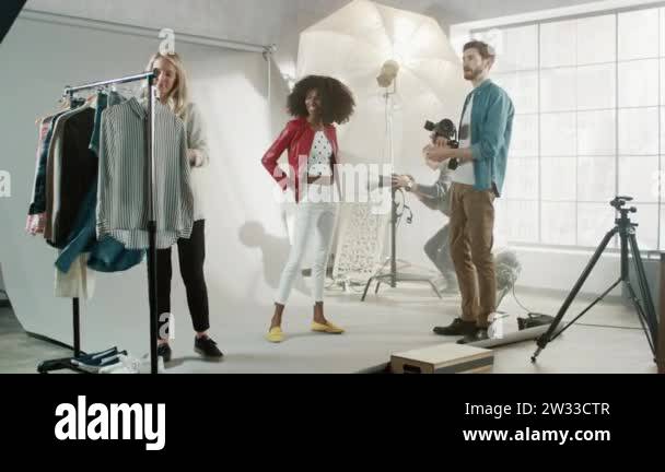 Backstage of the Photo Shoot: Stylist Chooses Outfit and Clothes for a ...