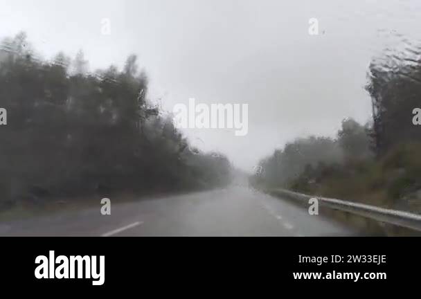 Driving through heavy rain storm dramatic northern scandinavian route ...