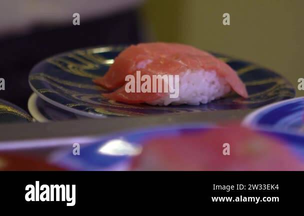 Slow motion of sushi on moving conveyor belt in a Japan restaurant ...