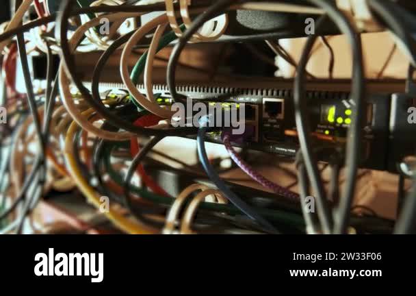 Network switch and ethernet cable in rack cabinet. Network connection ...