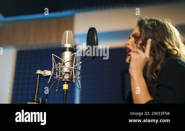 Beautiful young singer who recorded a song in a professional recording ...