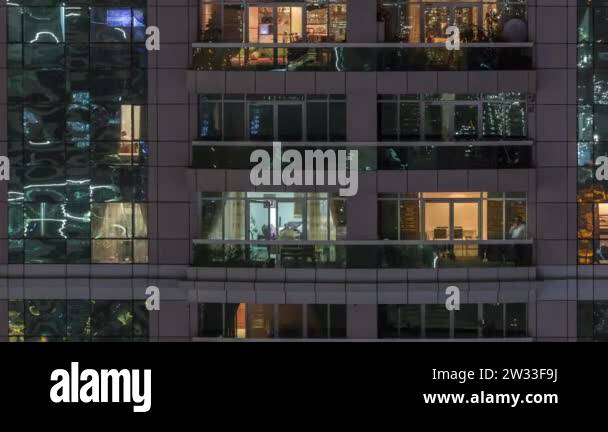 Night view of exterior apartment building timelapse. High rise ...