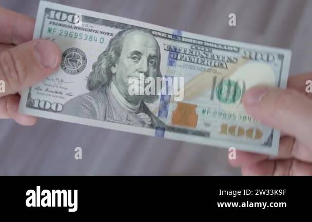 Man money cash 100 Stock Videos & Footage - HD and 4K Video Clips - Alamy