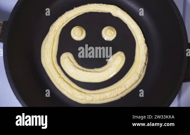 Smiley face made from butter, accelerated video. Butter being heated ...