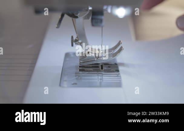 Close-up slow motion video of work of the master seamstress and needle ...