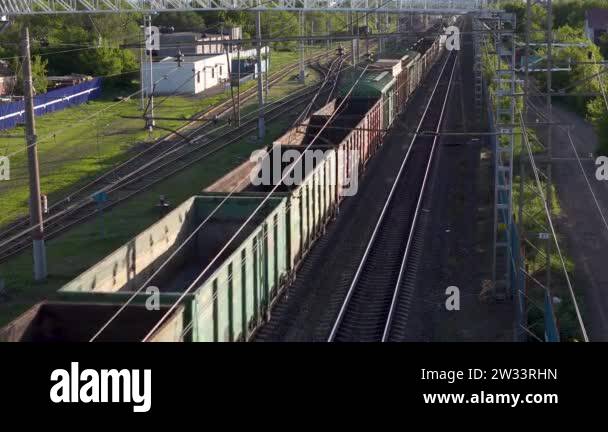 Freight train carries cargo. View of the train from above. Rail transport for intercity trade ...