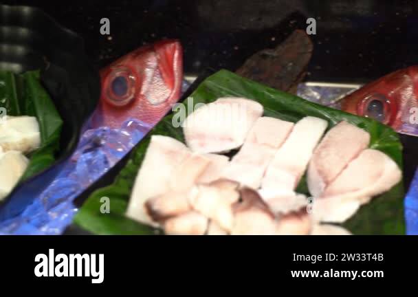 4K, fresh raw seafood in buffet line at Taiwan. Fish and tuna sashimi ...