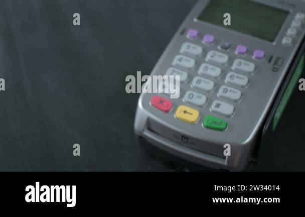 Pay by phone on the POS contactless payment terminal. A user makes a ...