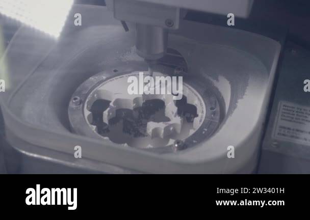 A professional CNC machine automatically creates a tooth prosthesis ...