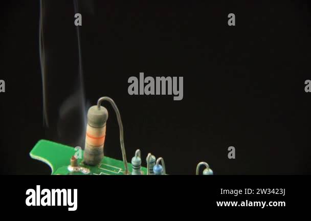 Electronic circuit shorted on resistor on PCB Stock Video Footage - Alamy